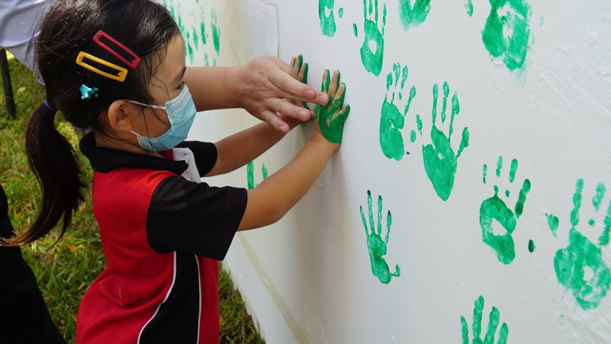 TK's handprint mural | CIS Mosaic
