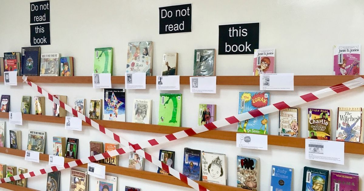 TK library's DO NOT READ THIS BOOK sign | Mosaic